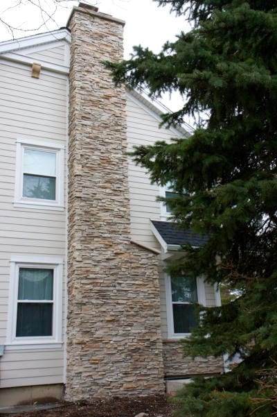 Exterior Stone and Hardie Board Sliding